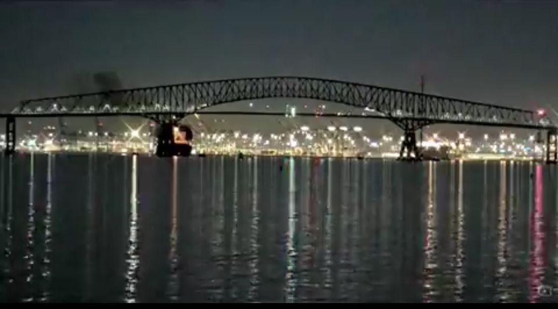 US bridge collapses into river after being hit by cargo ship - The ...
