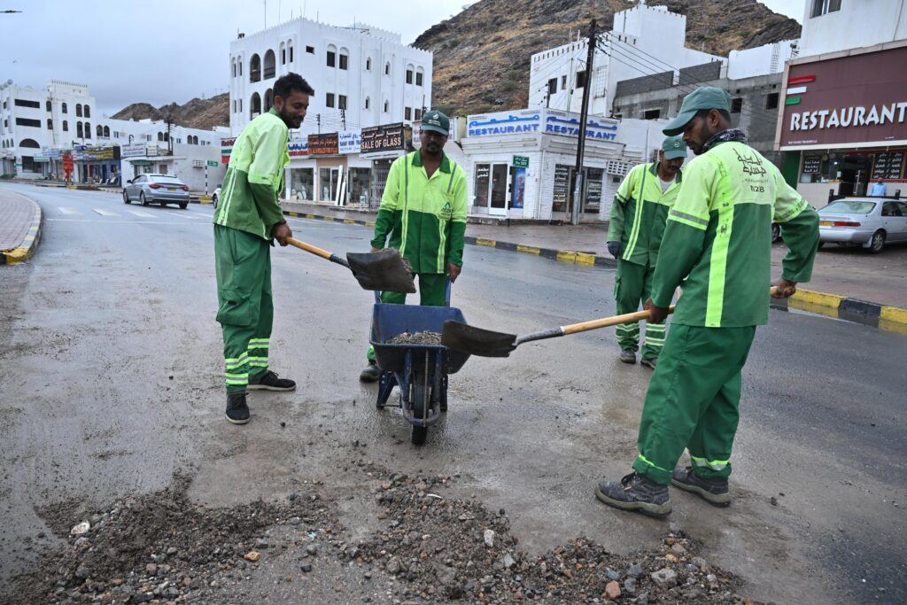 Muscat Municipality workers clear debris following last night’s rains ...