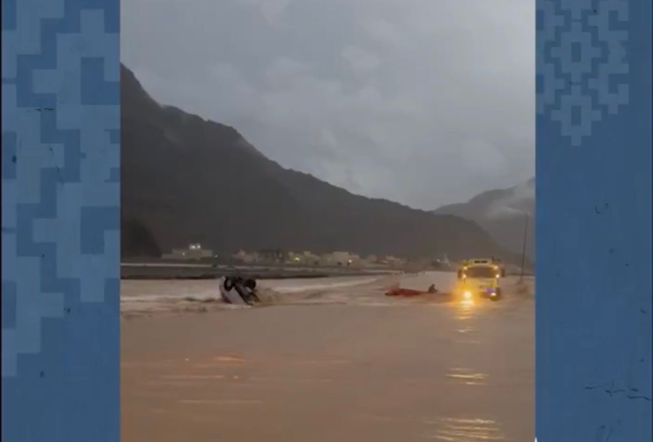 Driver rescued and detained after vehicle swept into flooded wadi in ...